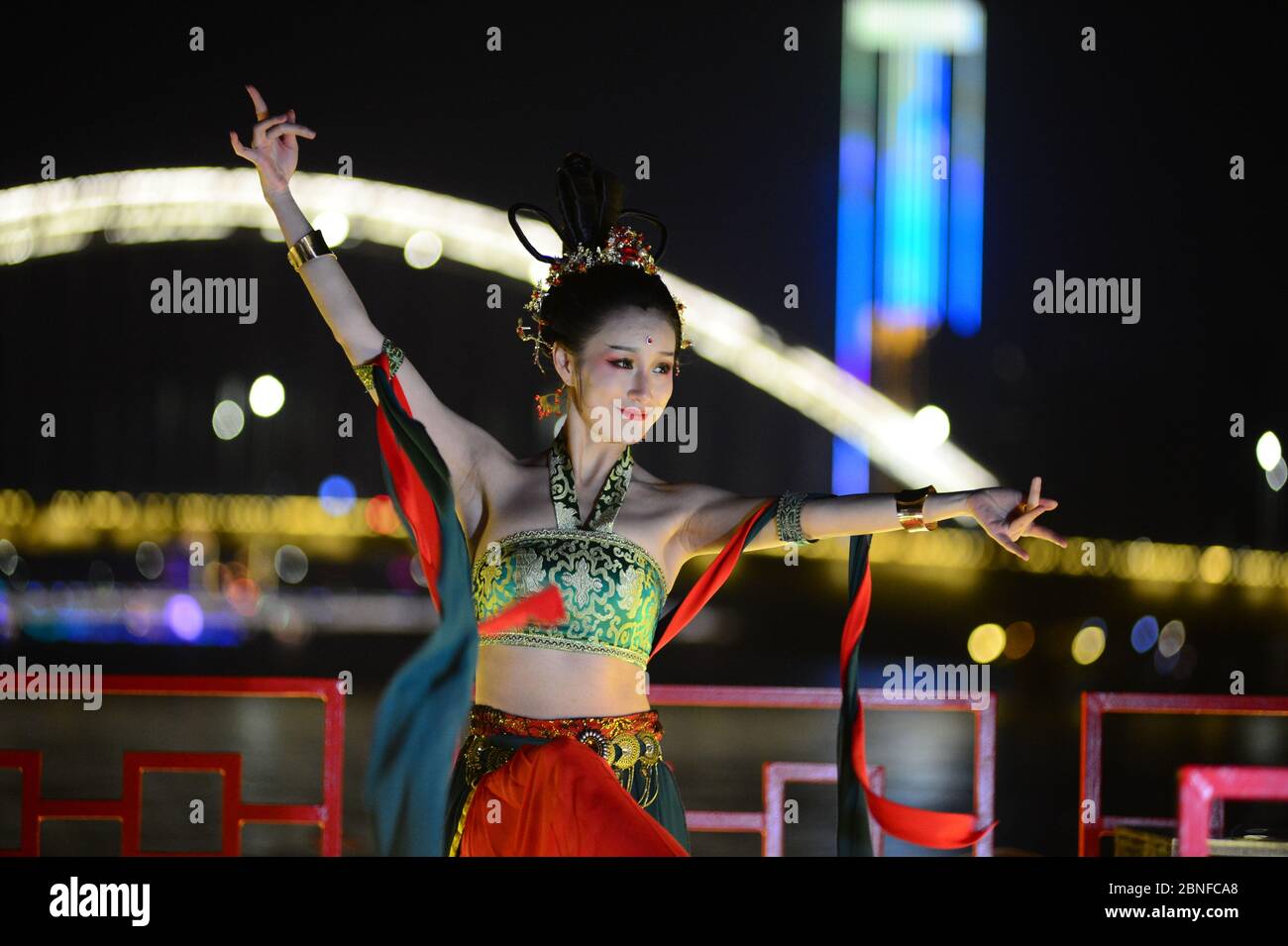 A performer plays Dunhuang Flying Apsaras Dance, which drew inspiration ...