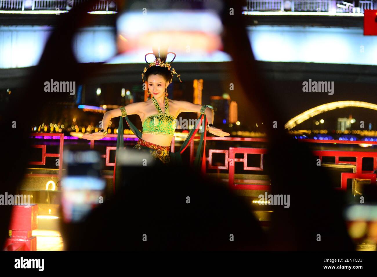 A performer plays Dunhuang Flying Apsaras Dance, which drew inspiration ...