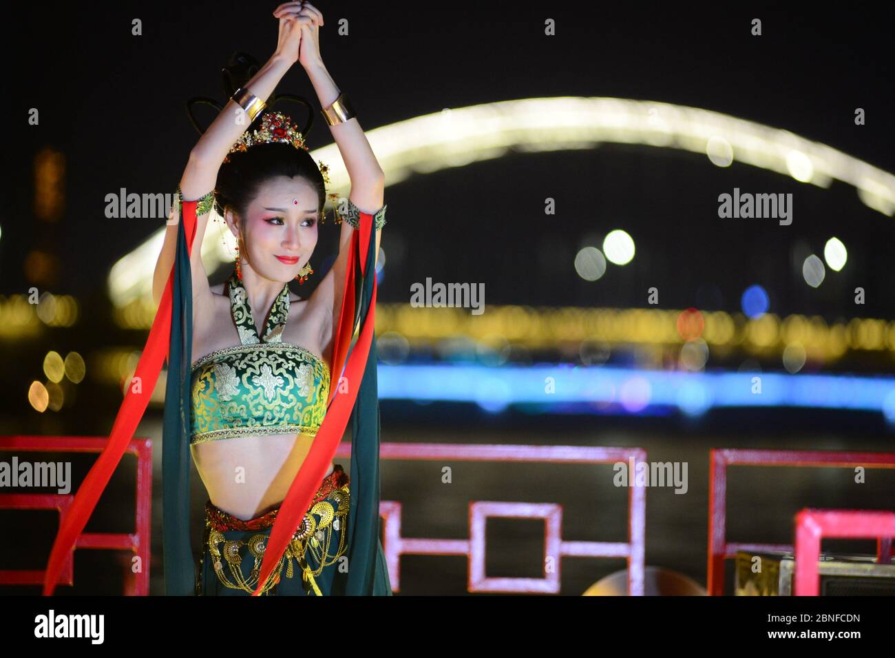 A performer plays Dunhuang Flying Apsaras Dance, which drew inspiration ...