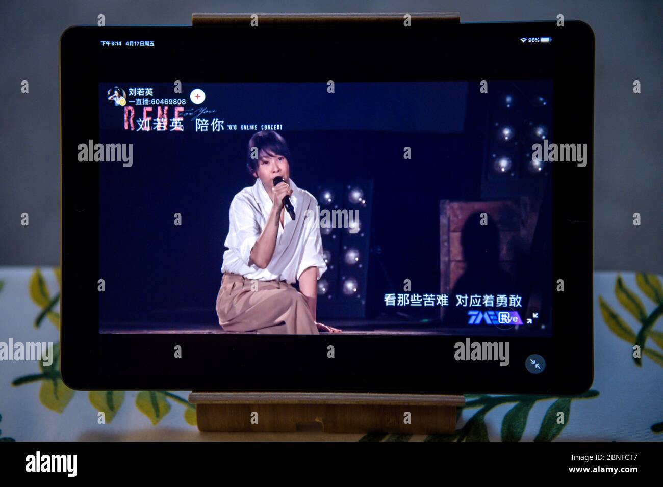 In this unlocated photo, a fan watches a livestream concert of Chinese ...