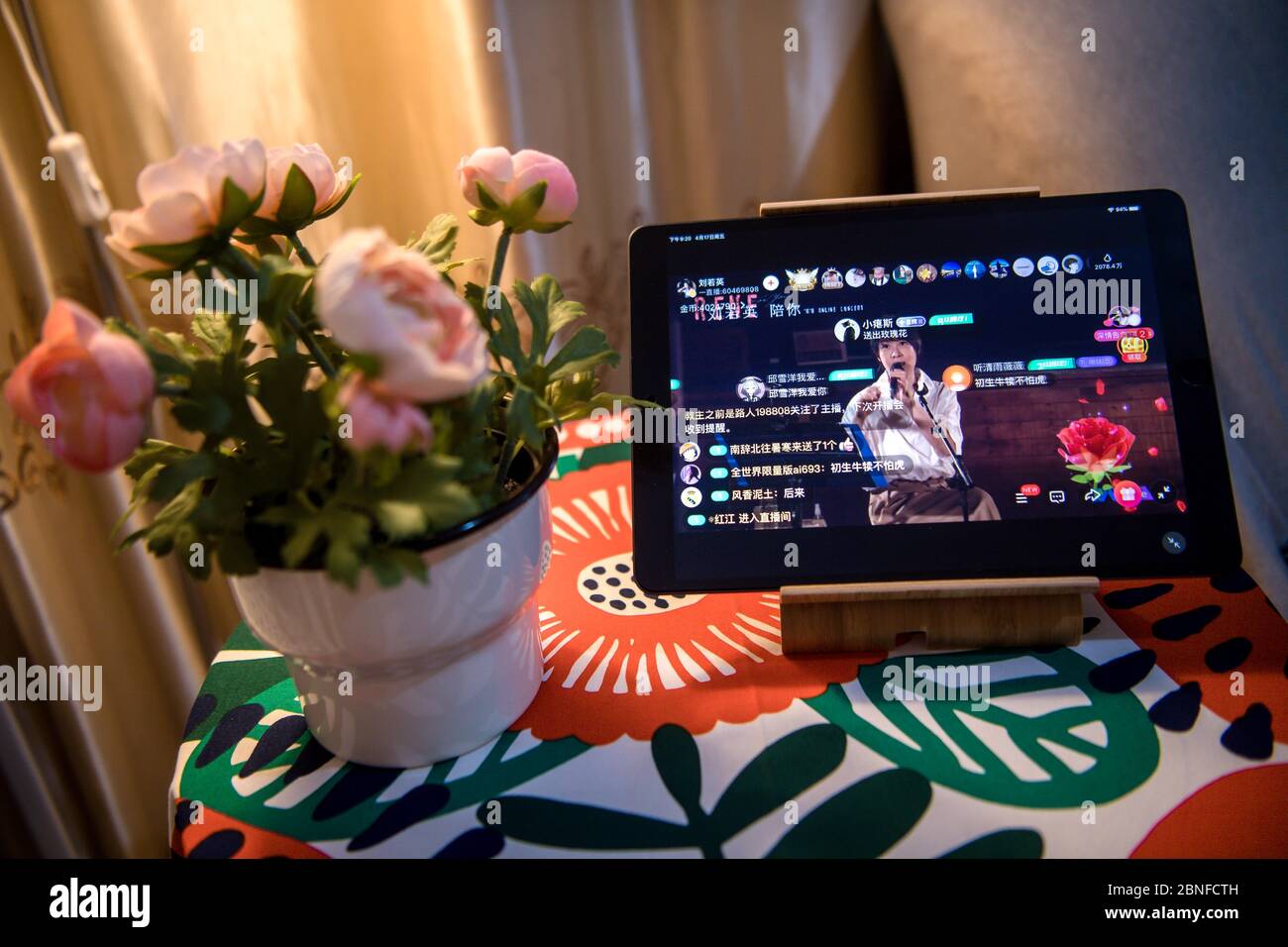 In this unlocated photo, a fan watches a livestream concert of Chinese ...