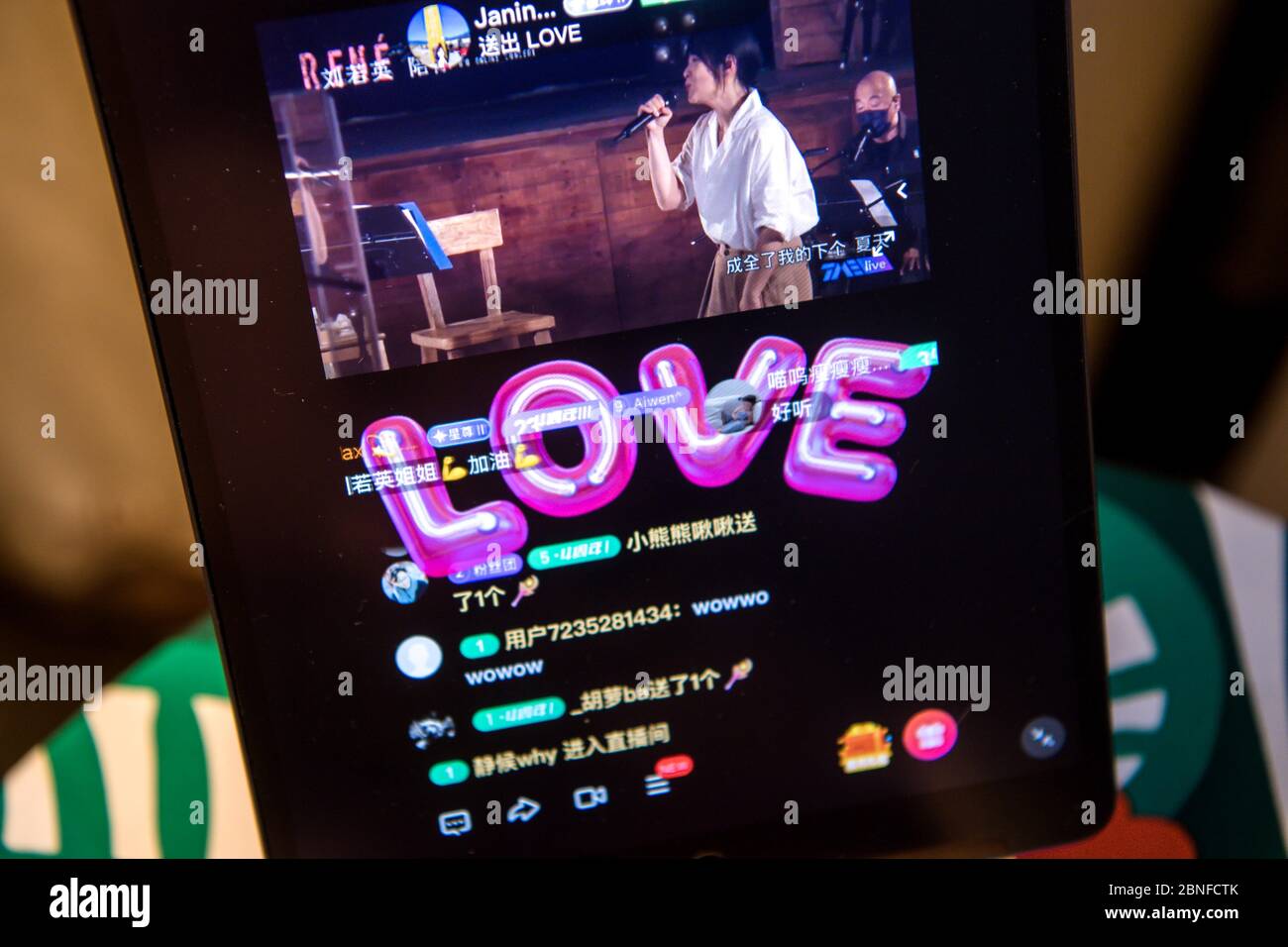 In this unlocated photo, a fan watches a livestream concert of Chinese ...