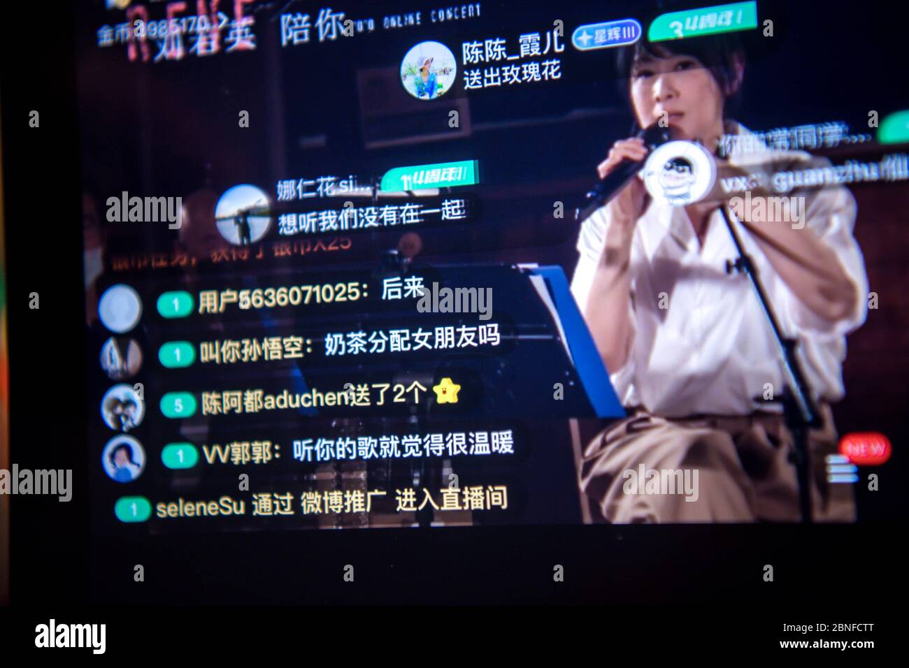 In this unlocated photo, a fan watches a livestream concert of Chinese ...