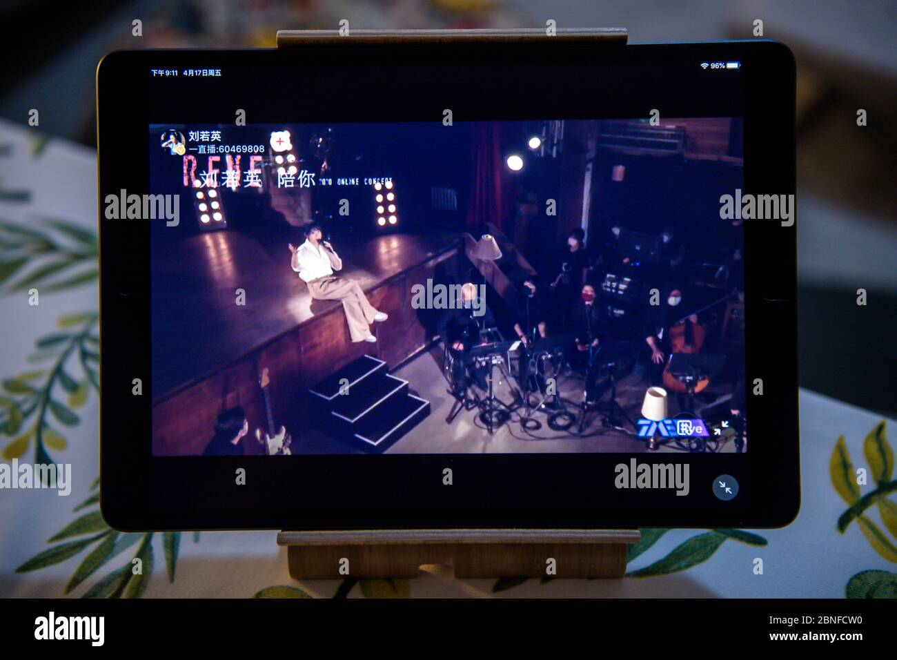 In this unlocated photo, a fan watches a livestream concert of Chinese ...