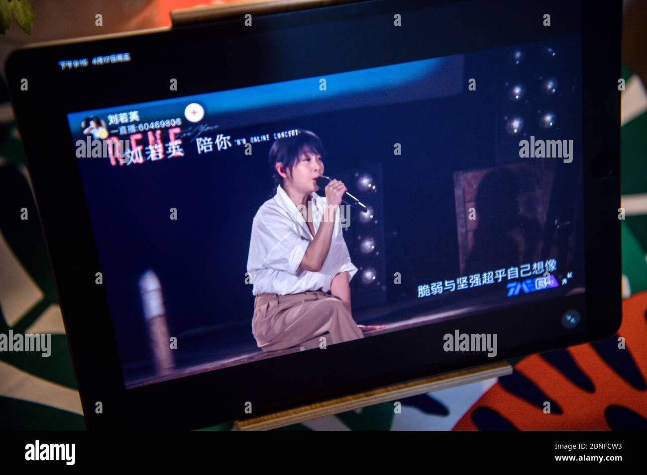 In this unlocated photo, a fan watches a livestream concert of Chinese ...