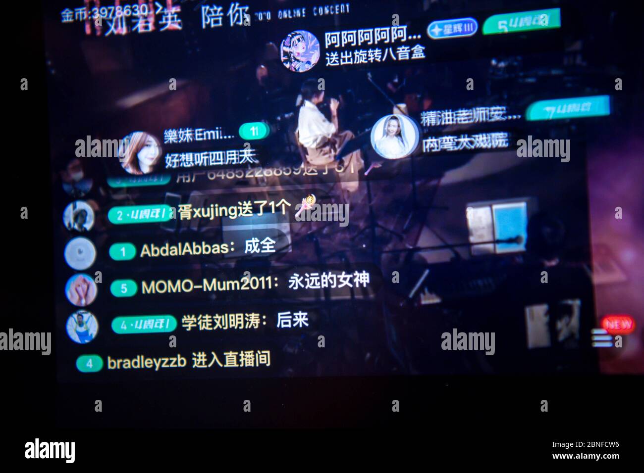 In this unlocated photo, a fan watches a livestream concert of Chinese ...