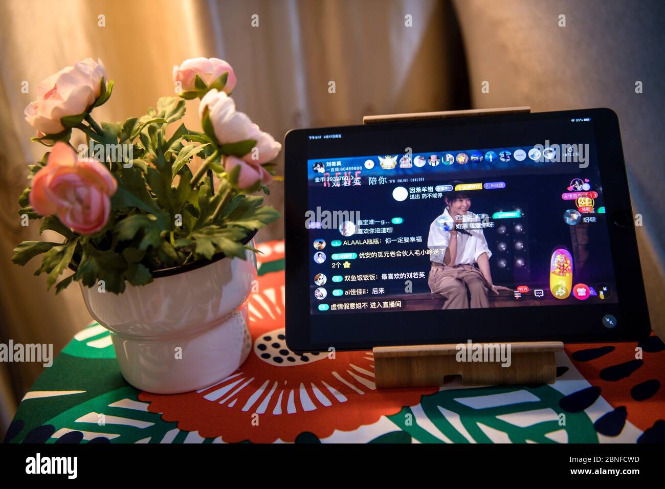 In this unlocated photo, a fan watches a livestream concert of Chinese ...