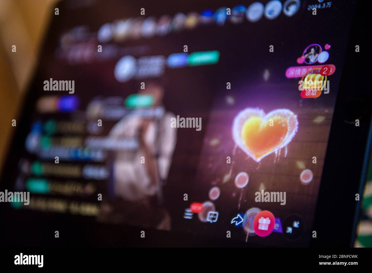 In this unlocated photo, a fan watches a livestream concert of Chinese ...
