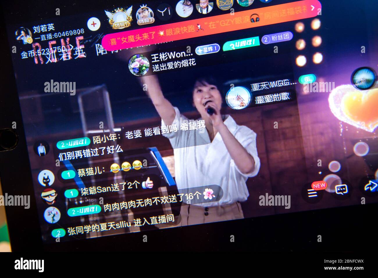 In this unlocated photo, a fan watches a livestream concert of Chinese ...