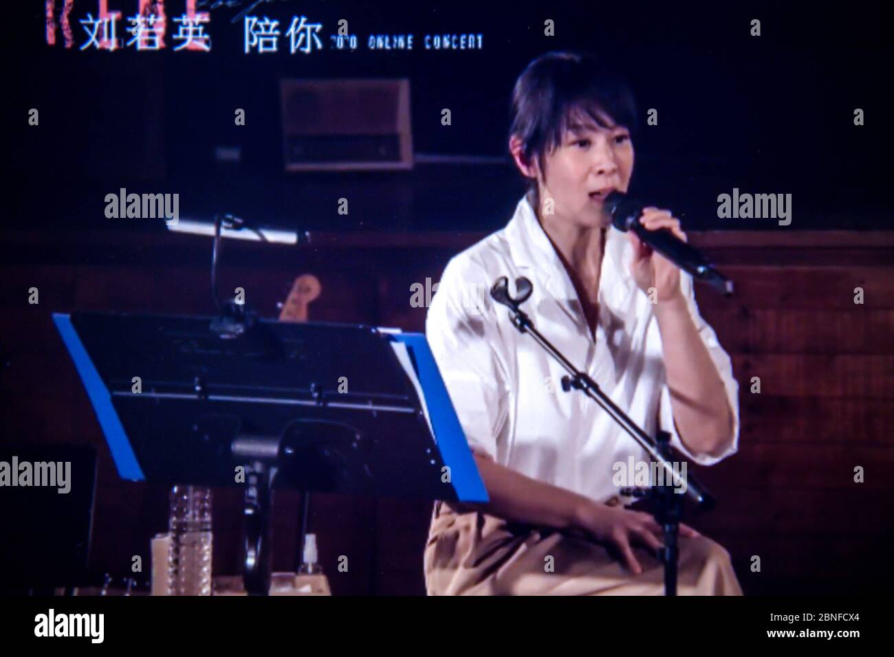 In this unlocated photo, a fan watches a livestream concert of Chinese ...