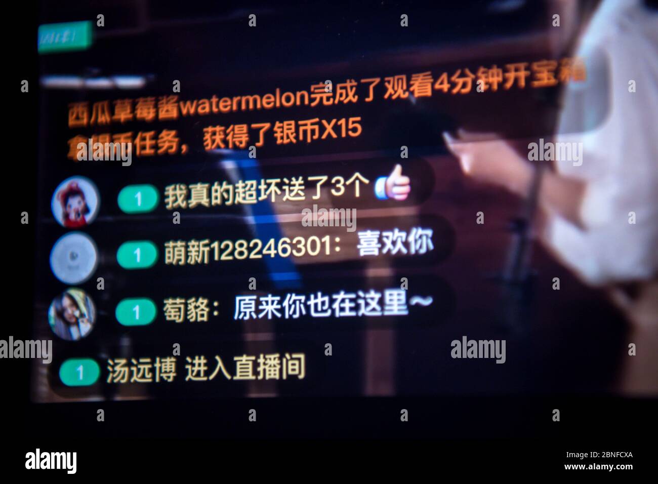 In this unlocated photo, a fan watches a livestream concert of Chinese ...