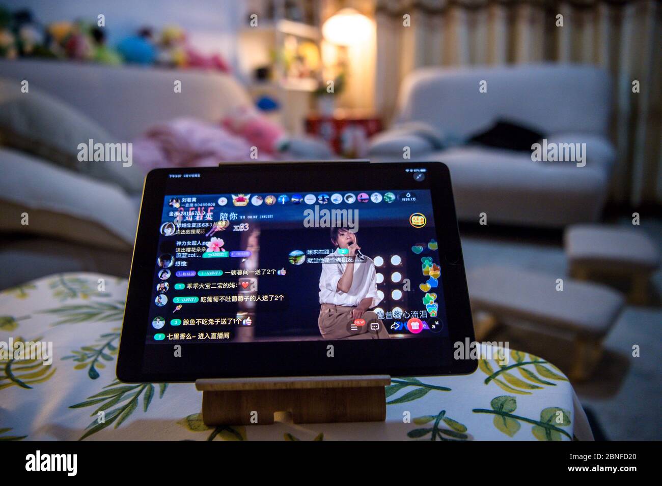 In this unlocated photo, a fan watches a livestream concert of Chinese ...