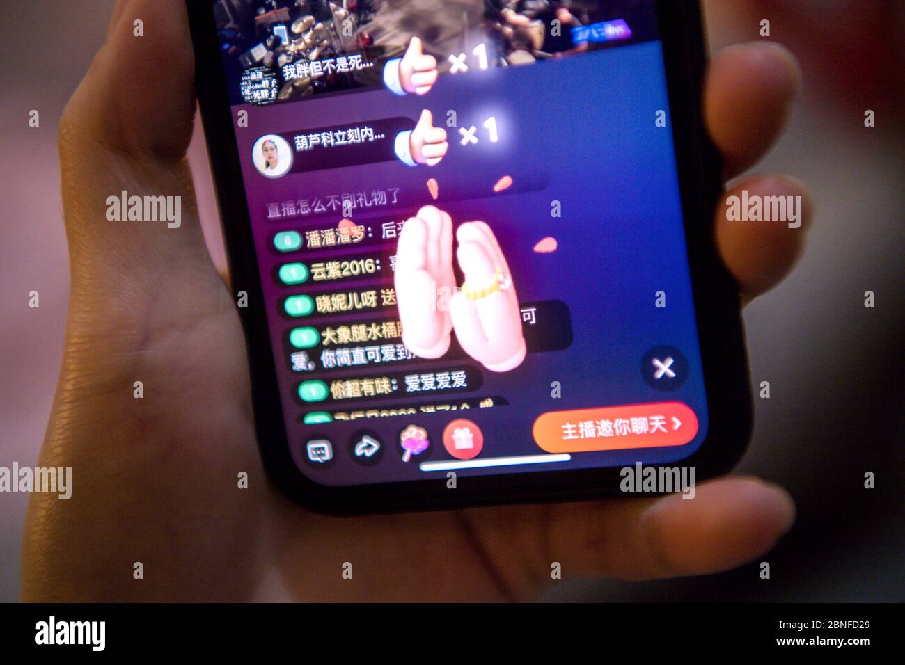 In this unlocated photo, a fan watches a livestream concert of Chinese ...