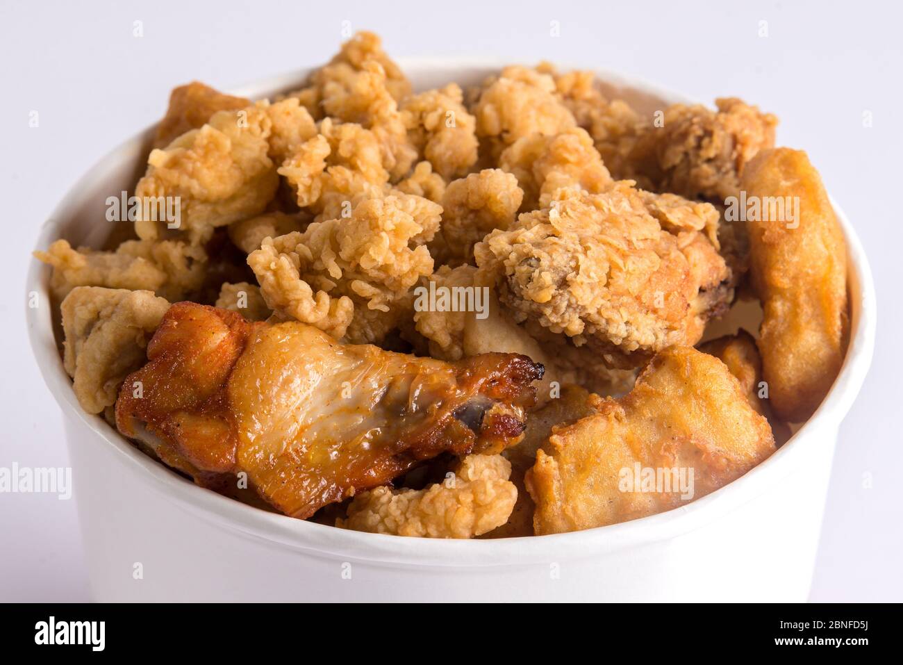 In this unlocated photo, a bucket meal, including chicken nuggets ...