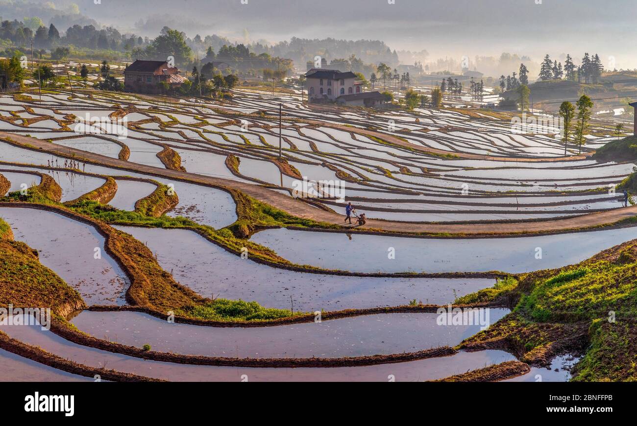 An aerial view of terraces on a hill near a small mountain village ...