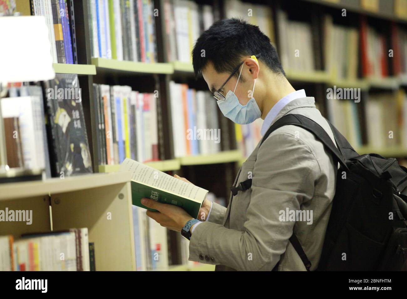 Readers take the chance reading at Librairie Avant-Garde, a bookstore ...