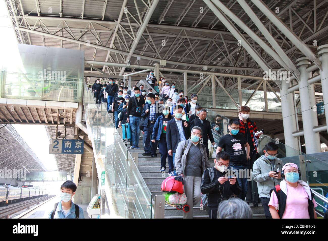 Crowd of passengers walk at Nanjing Railway Station, waiting for the ...