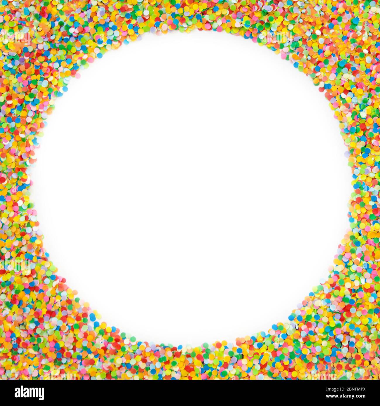 Round frame made of colored confetti. White background. Festive ...