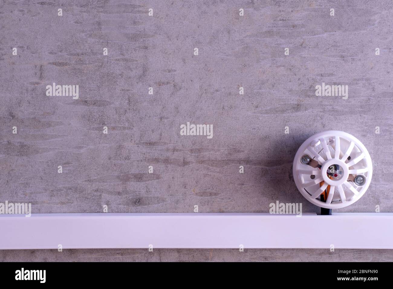 fire detector installed on a concrete wall Stock Photo - Alamy