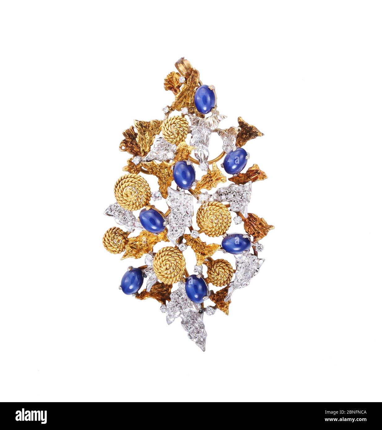 Precious golden pendant with gemstones under the lights isolated on a ...