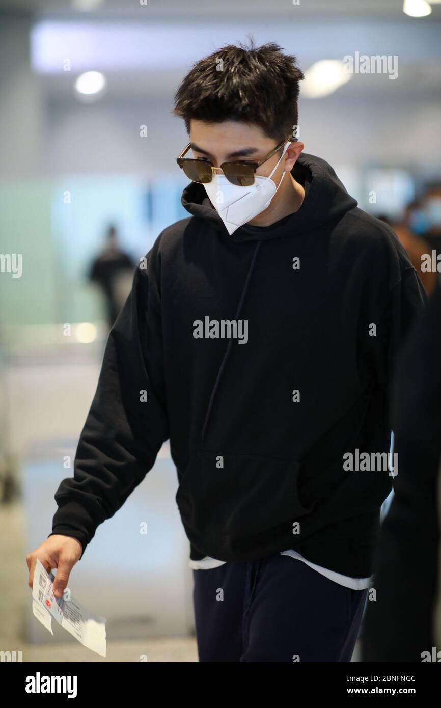 Chinese actor and singer Jin Han arrives at a Shanghai airport before ...