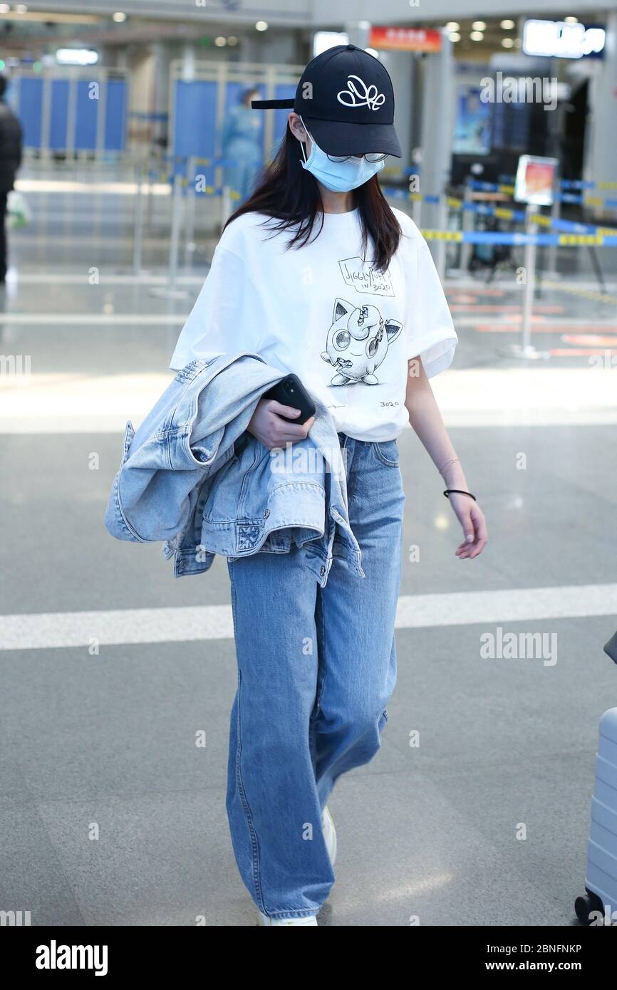 Chinese actress Chen Yuqi or Yukee Chen arrives at a Beijing airport ...