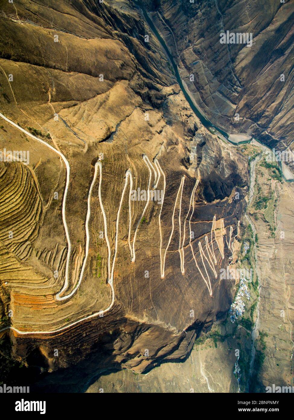 Aerial view of the zigzag mountain road in Xueshan Village in Kunming ...