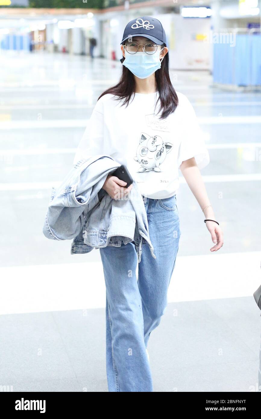 Chinese actress Chen Yuqi or Yukee Chen arrives at a Beijing airport ...