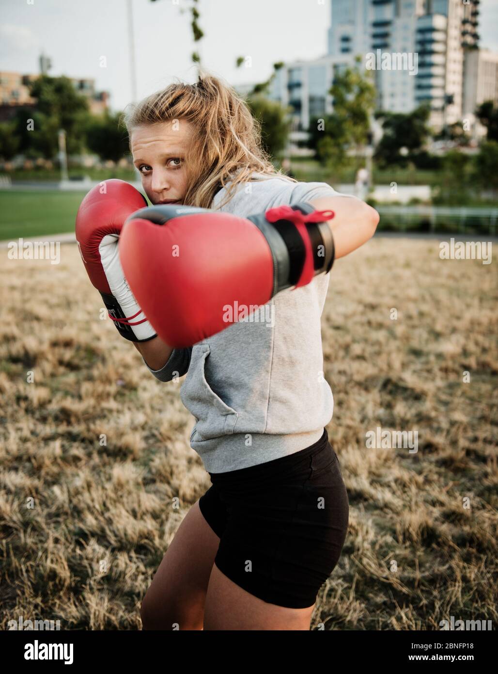 Beautiful woman boxing gloves smiling hi-res stock photography and ...