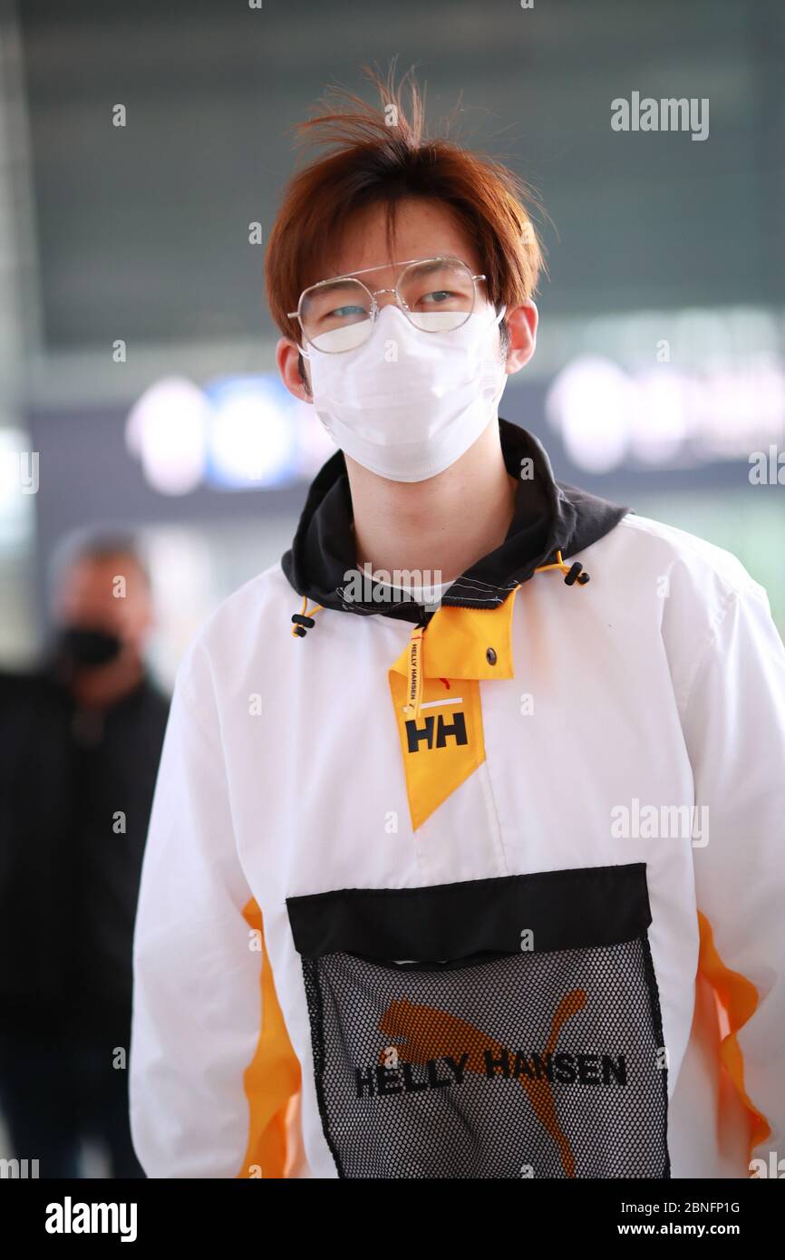 Chinese singer and actor Dong Li arrives at a Shanghai airport before ...