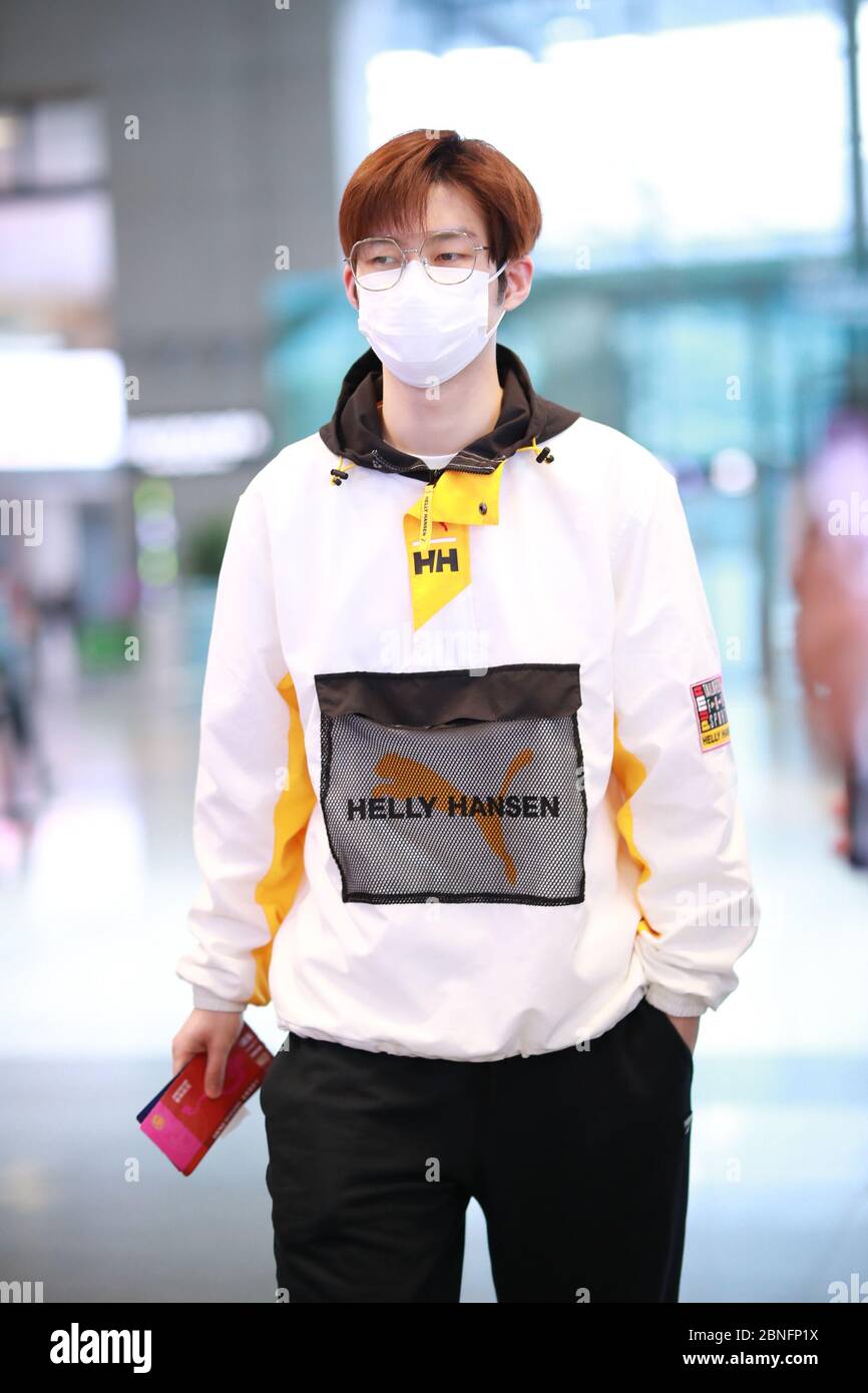 Chinese singer and actor Dong Li arrives at a Shanghai airport before ...