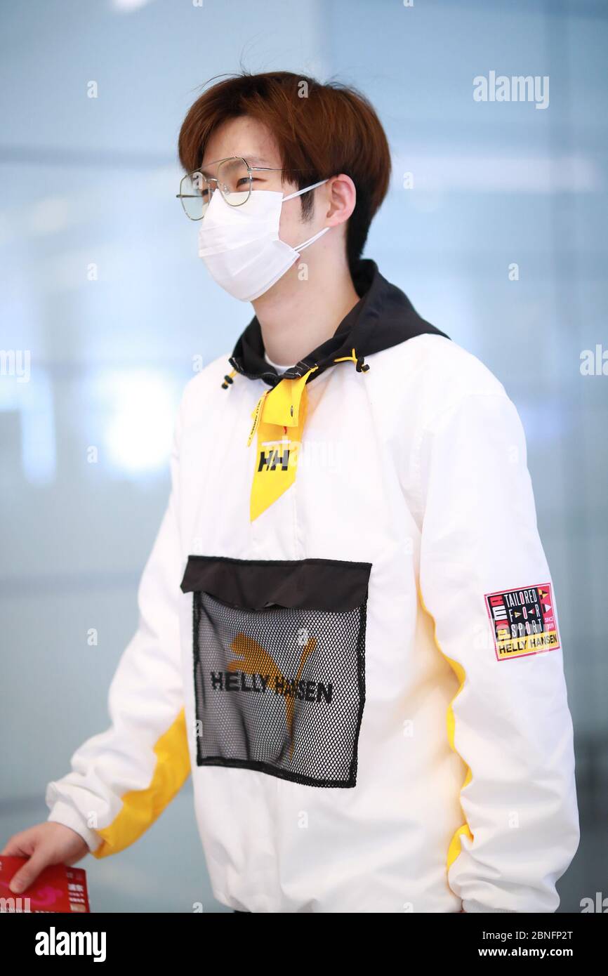 Chinese singer and actor Dong Li arrives at a Shanghai airport before ...