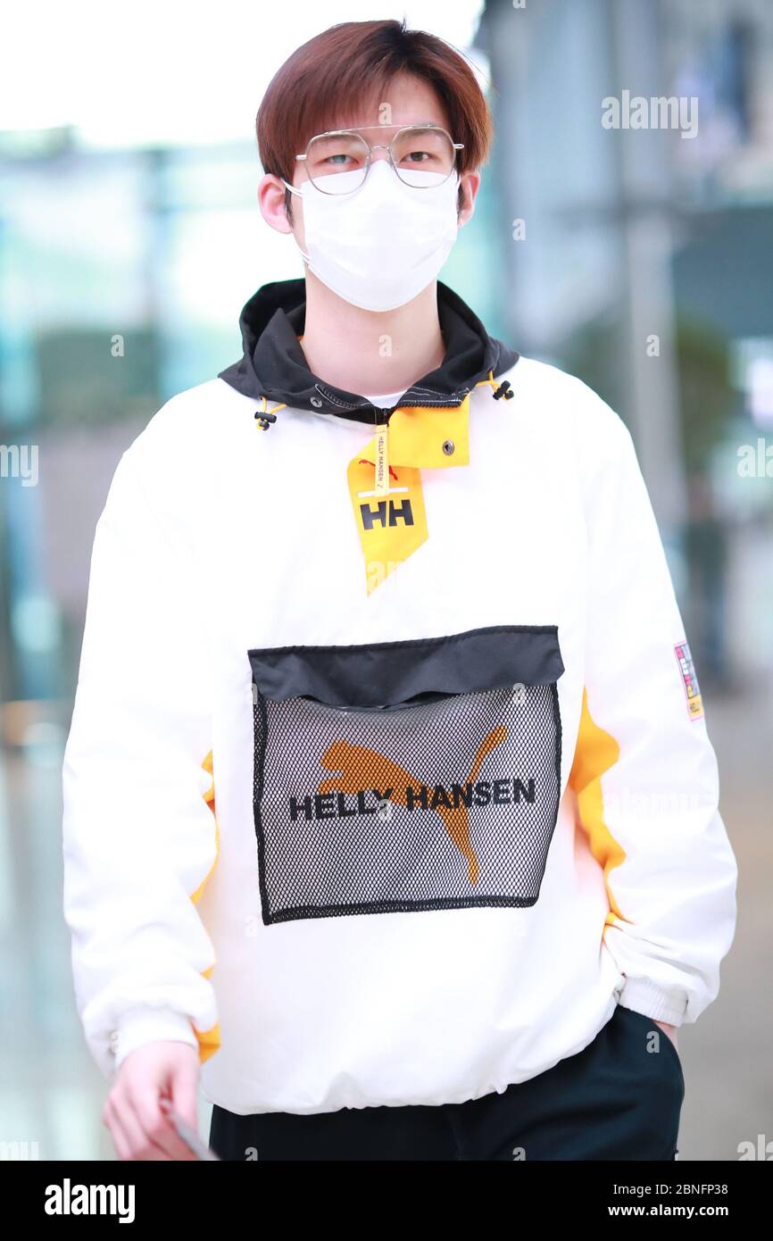 Chinese singer and actor Dong Li arrives at a Shanghai airport before ...