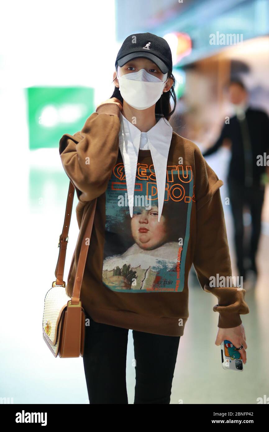 Chinese actress Lin Yun arrives at a Shanghai airport before departure ...