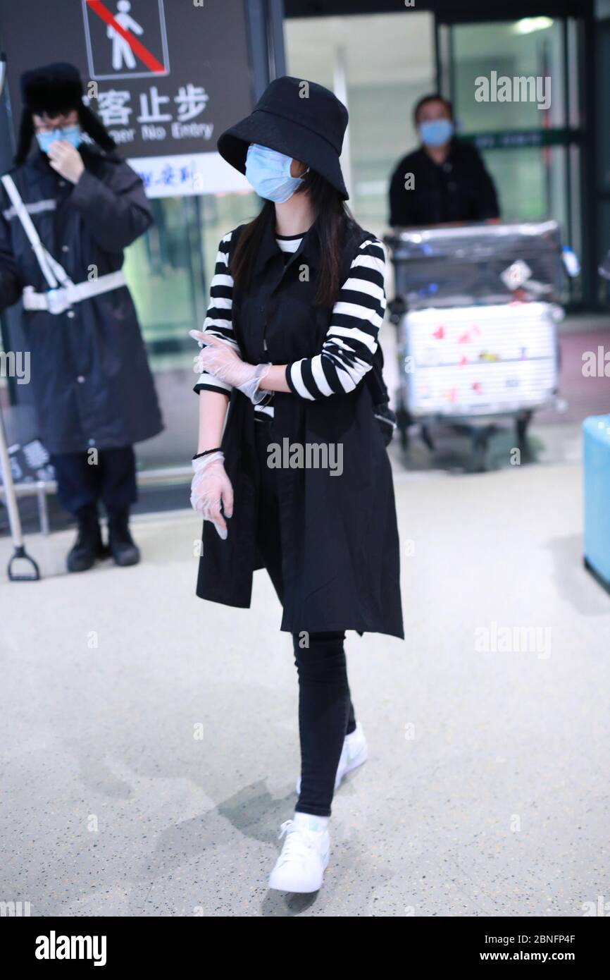 Chinese actress Tan Songyun arrives in an airport in Beijing, China ...