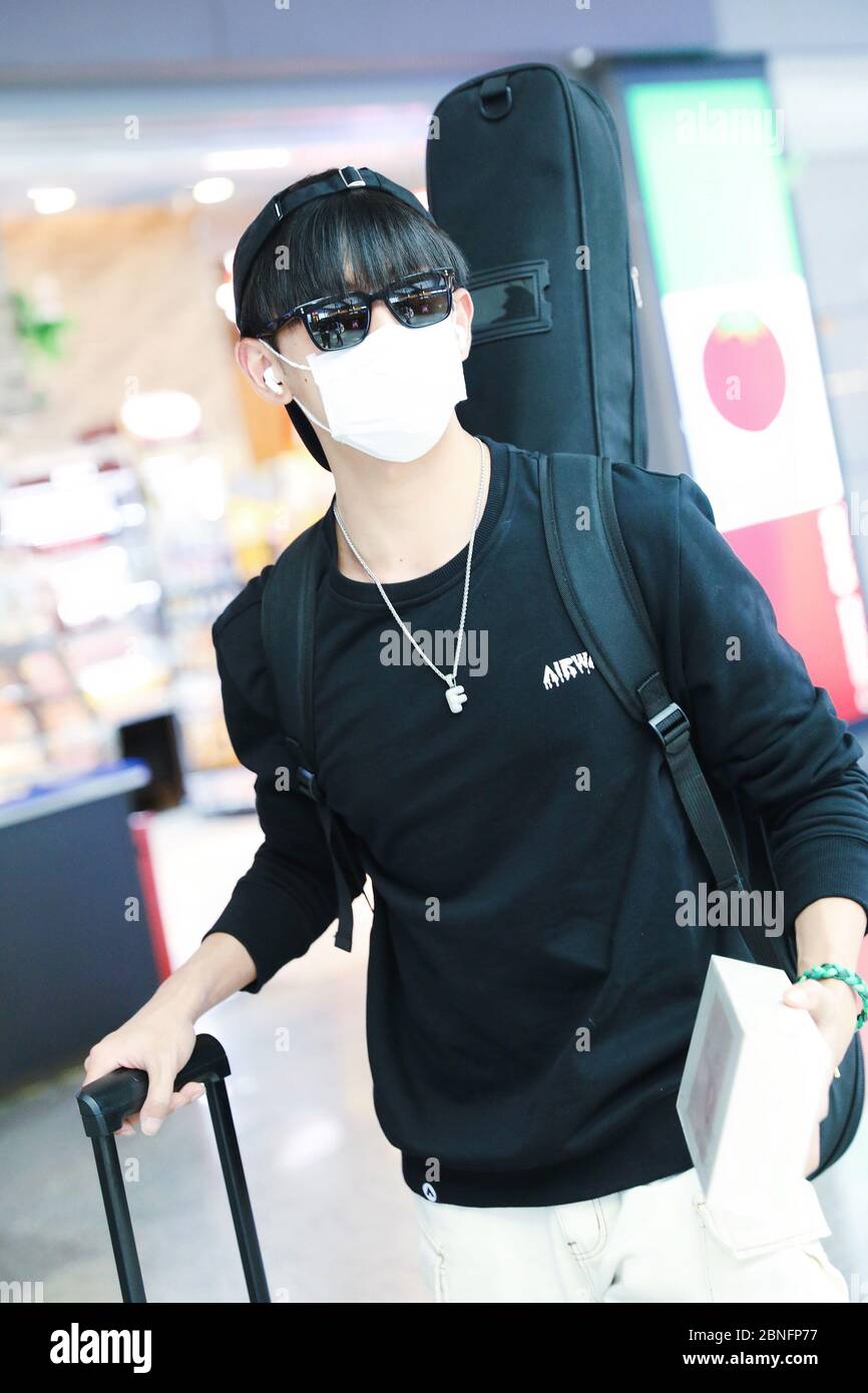 Chinese actor Fan Jinwei shows up at a train station before departure ...