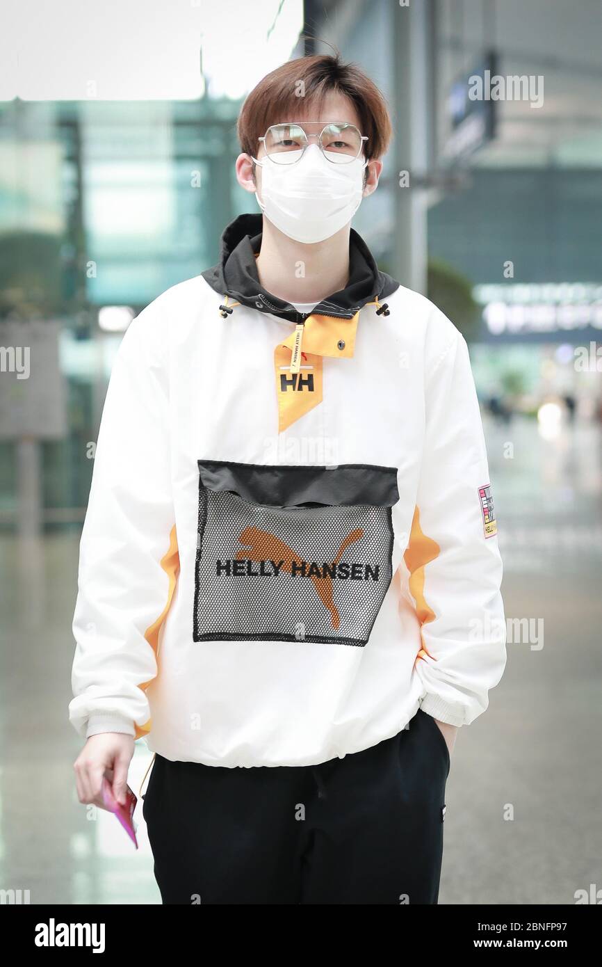 Chinese singer and actor Dong Li arrives at a Shanghai airport before ...