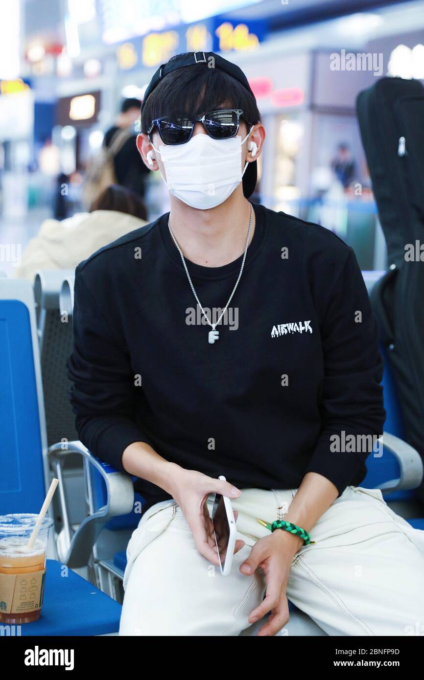 Chinese actor Fan Jinwei shows up at a train station before departure ...