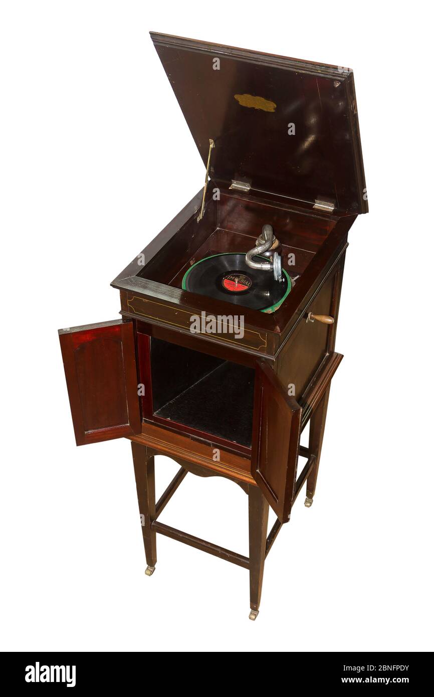 Vertical shot of a vintage vinyl player under the lights isolated on a ...