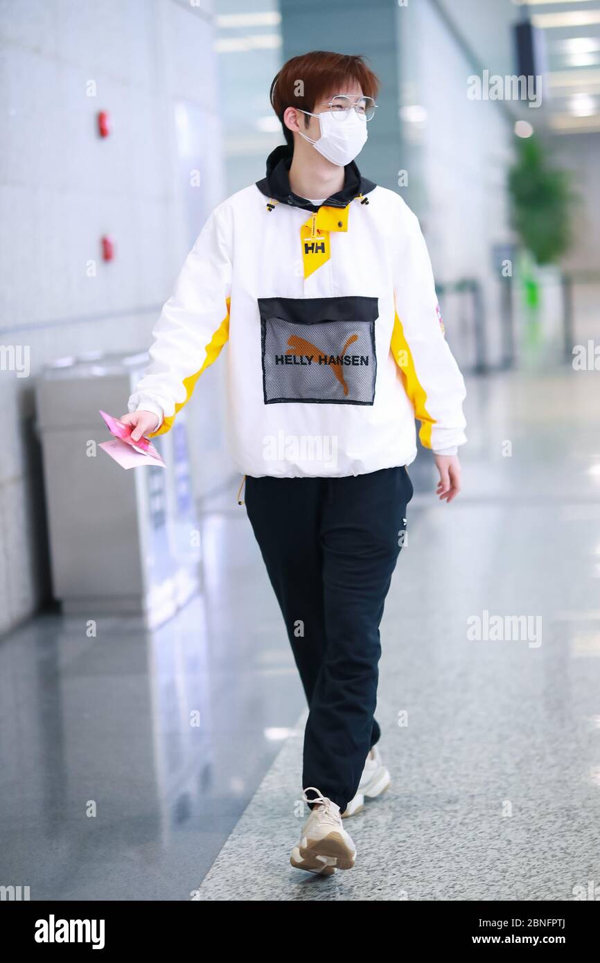 Chinese singer and actor Dong Li arrives at a Shanghai airport before ...