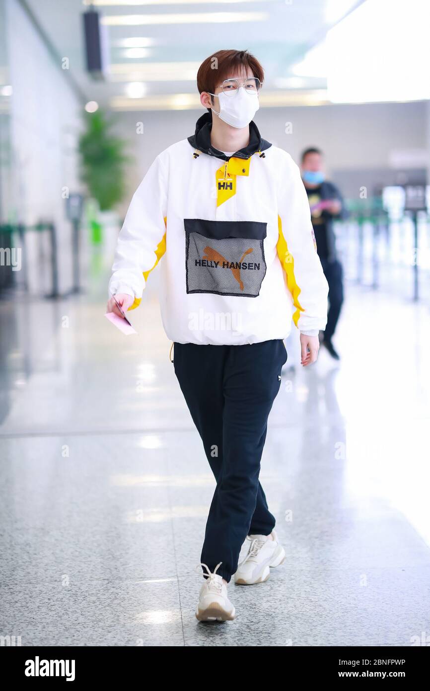 Chinese singer and actor Dong Li arrives at a Shanghai airport before ...