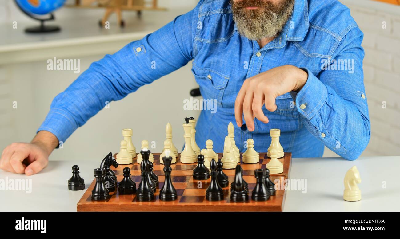 Playing chess. Intellectual hobby. Figures on wooden chess board ...