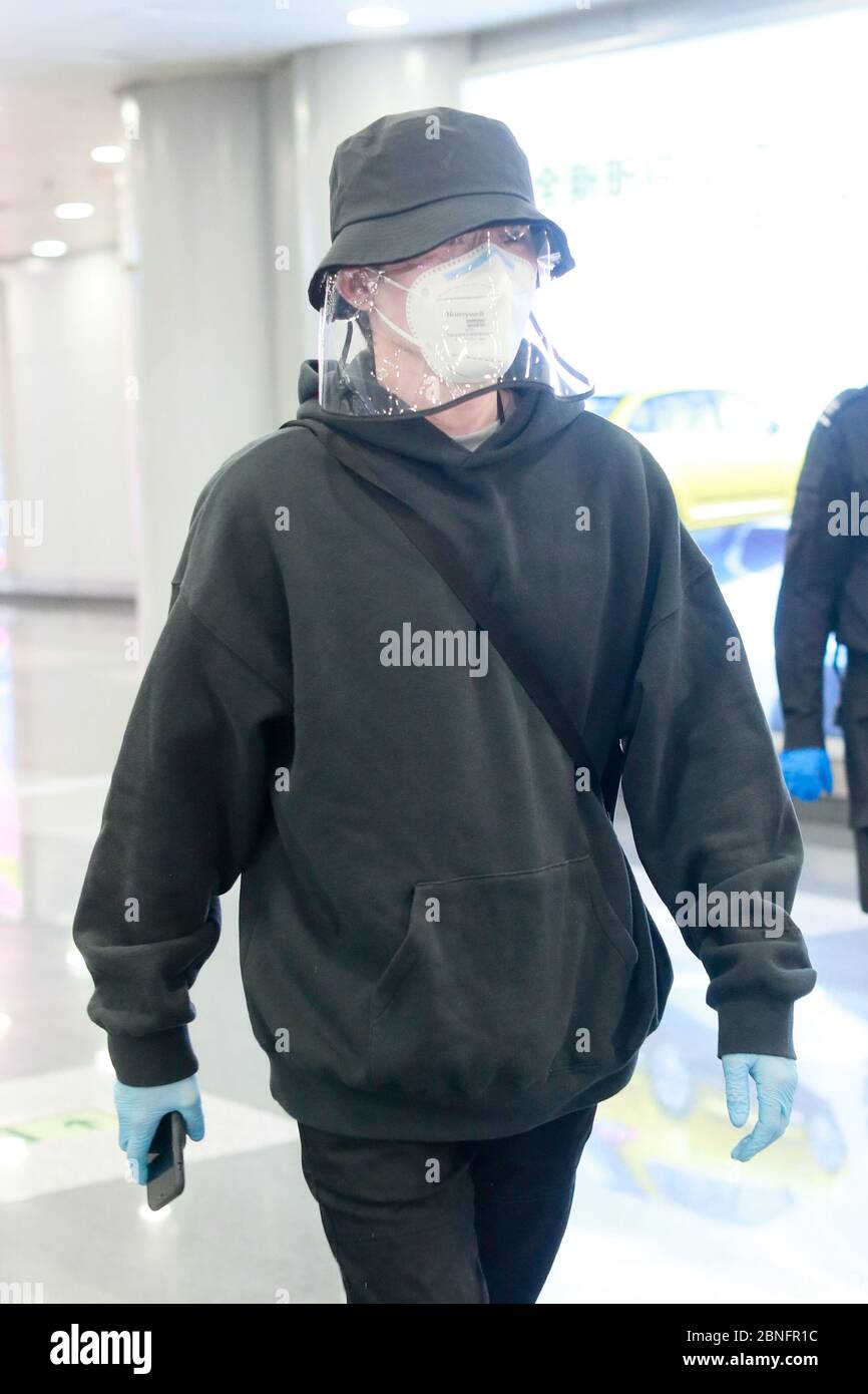 Chinese actress and singer Xu Dongdong arrives at a Beijing airport ...