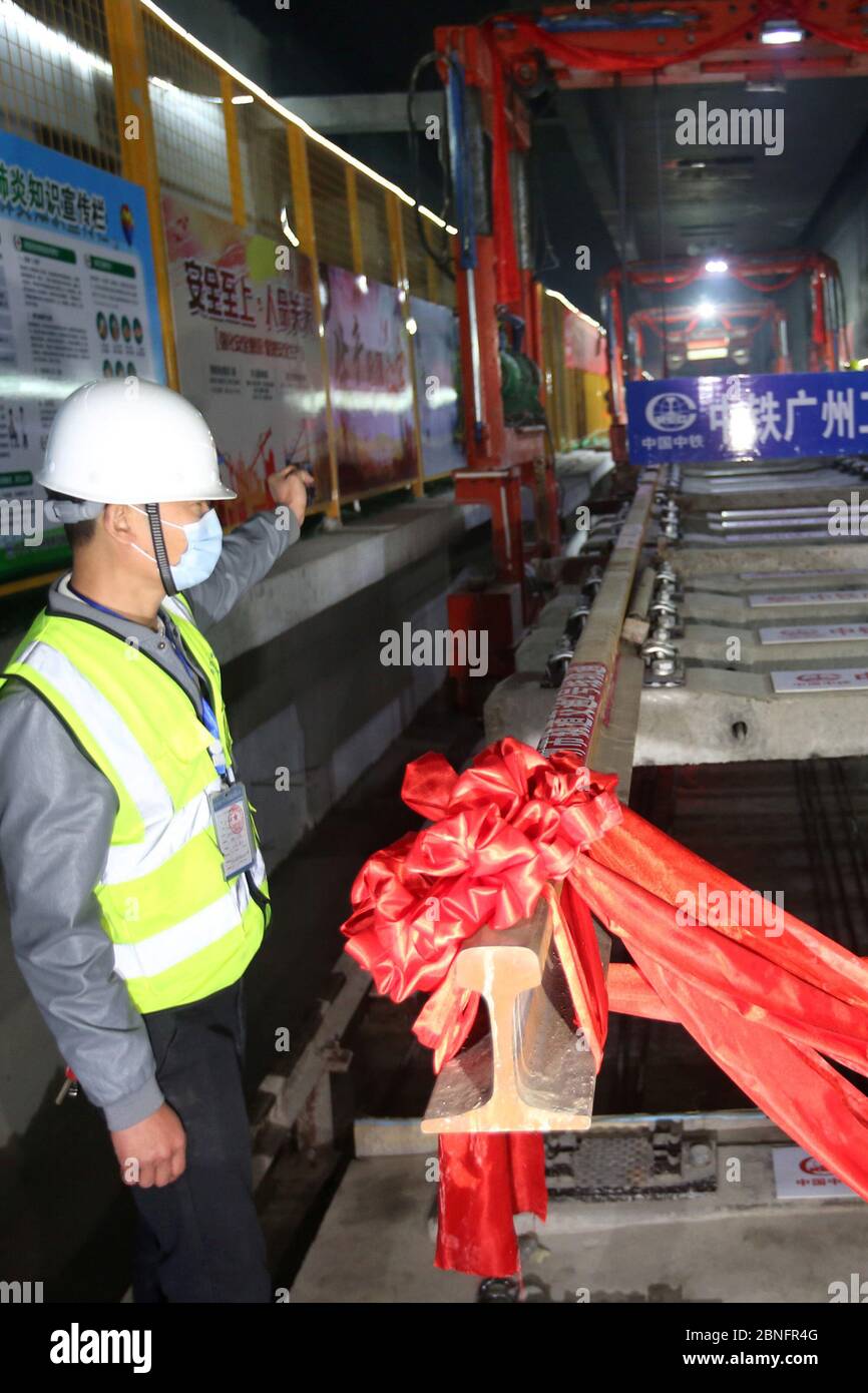 Construction workers hold a simple ceremony to celebrate the finish of ...