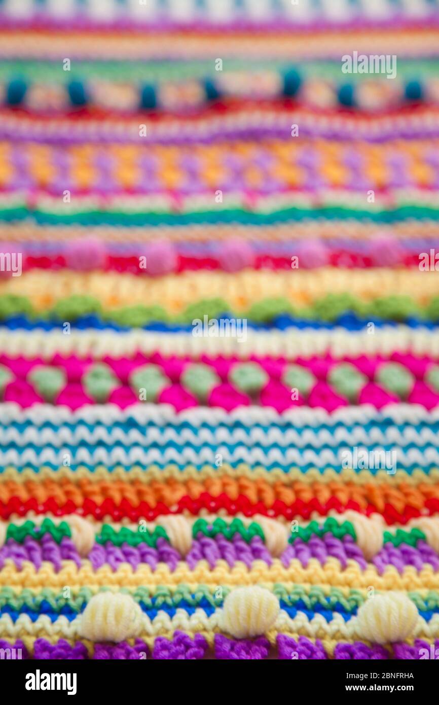 Knitted color background. Knitted texture. A sample of knitting from ...