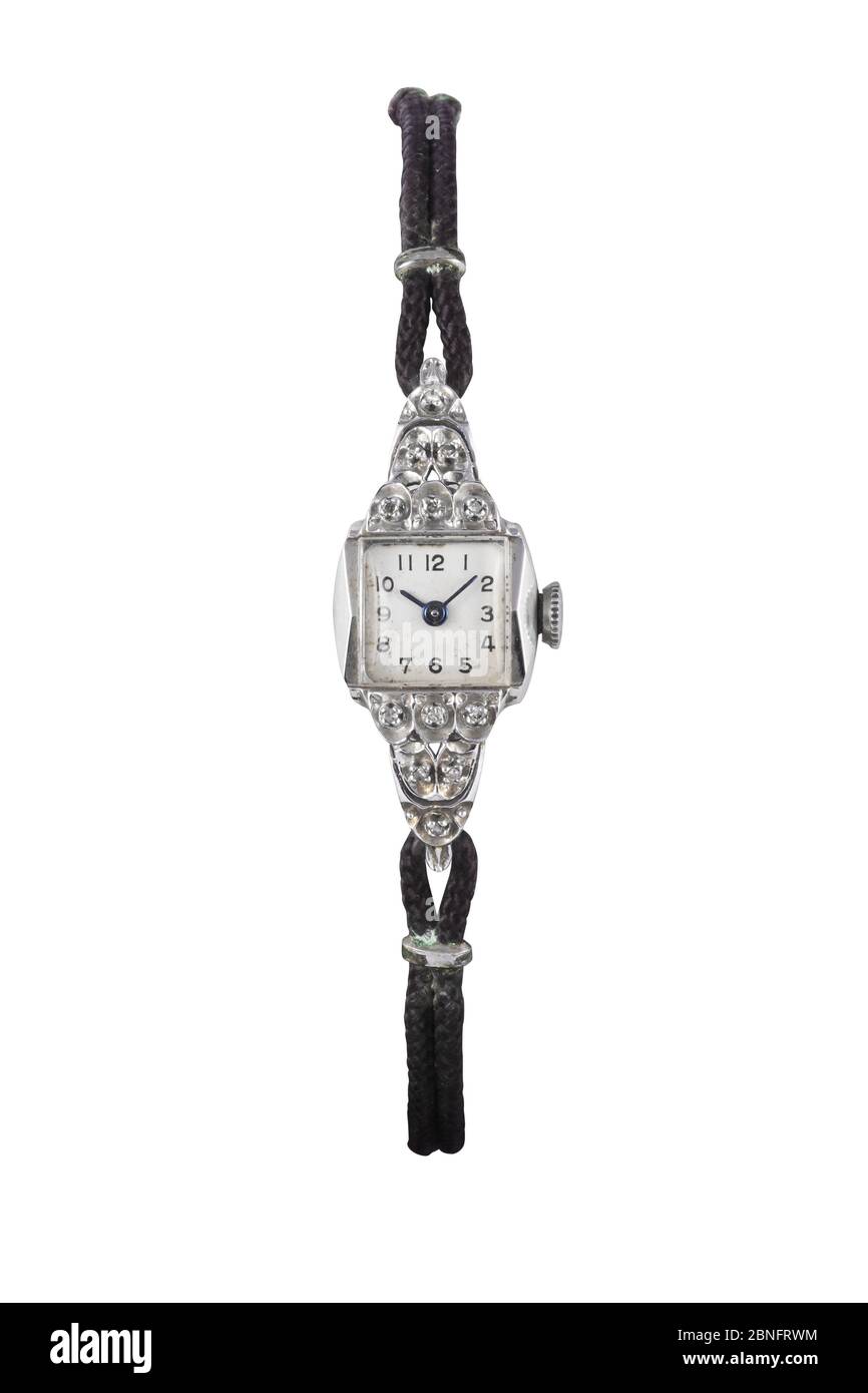 Vertical shot of an elegant silver watch under the lights isolated on a ...