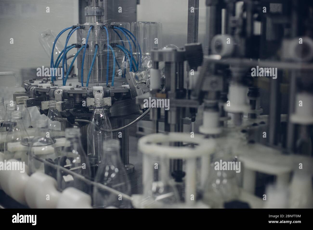 Grayscale selective focus shot of plastic bottle factory Stock Photo ...