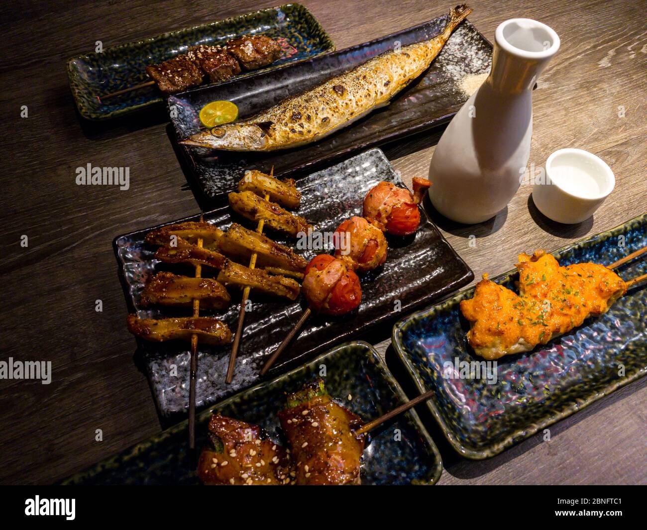 Set of delicious traditional skewers grilled and a fish for dinner ...