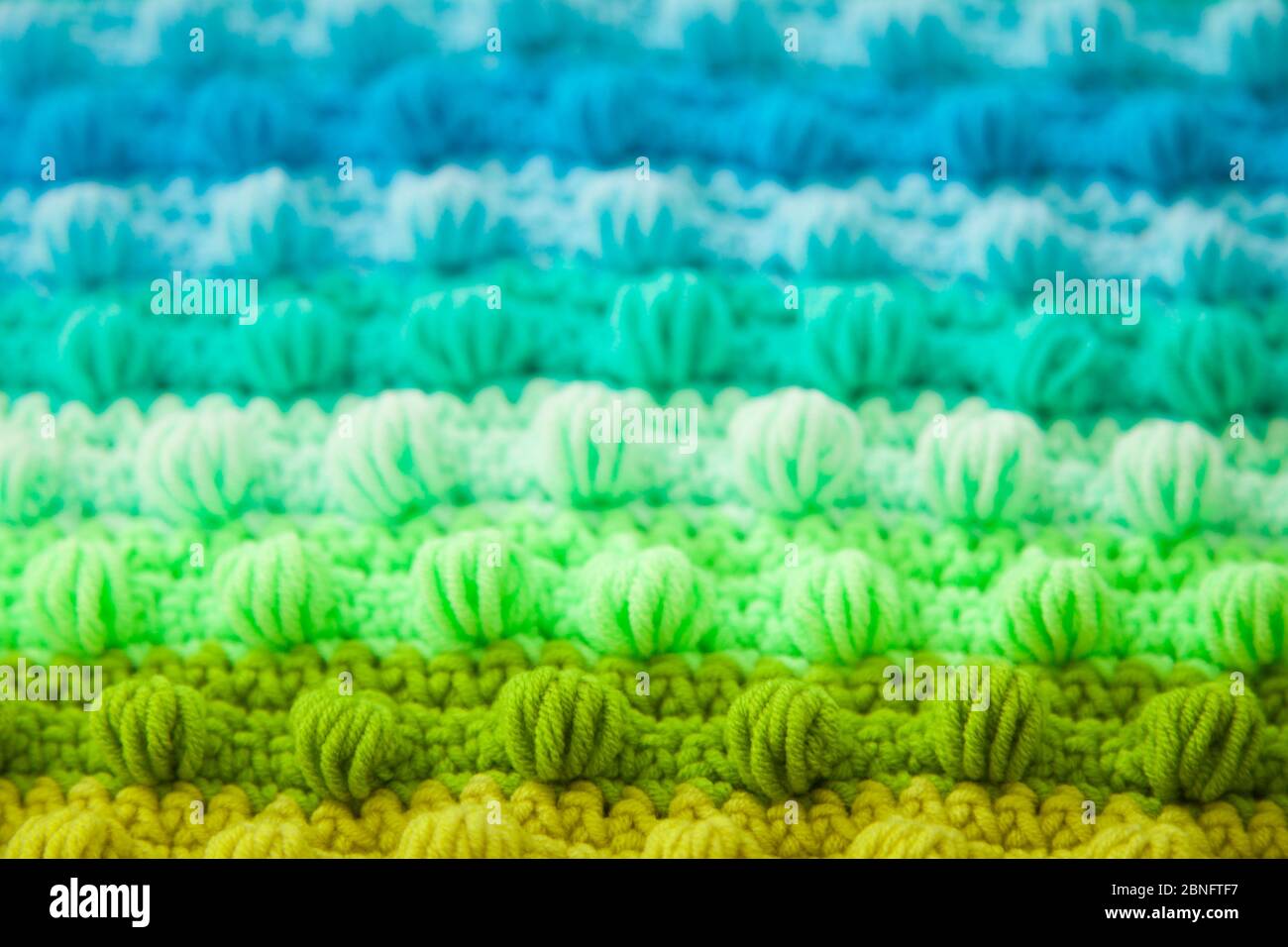 Knitted color background. Knitted texture. A sample of knitting from ...