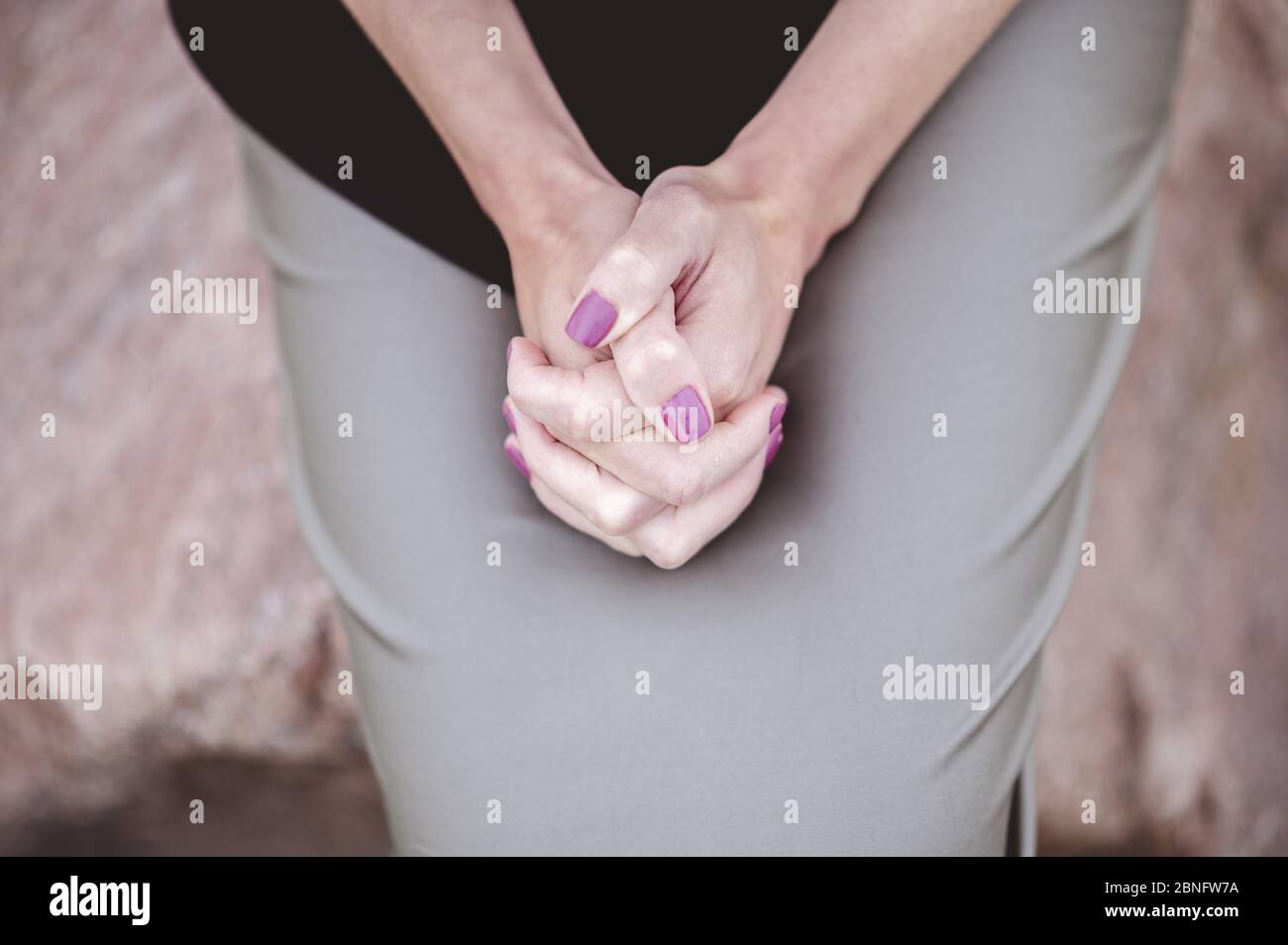 Sitting waiting hands on lap hi-res stock photography and images - Alamy